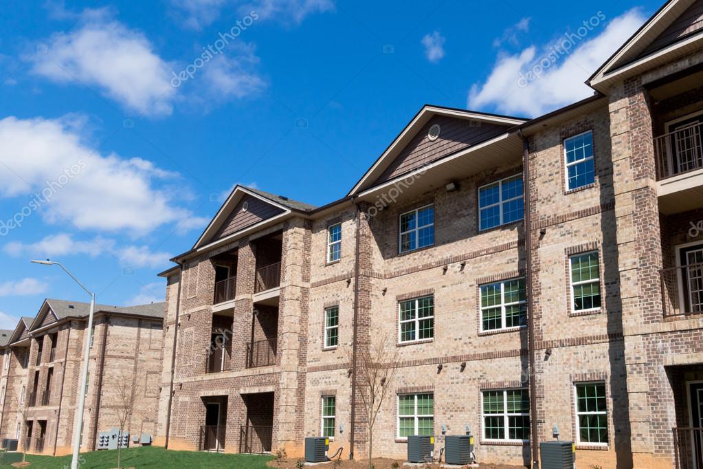 Apartment complex buildings — Stock Photo © kzlobastov #69030421