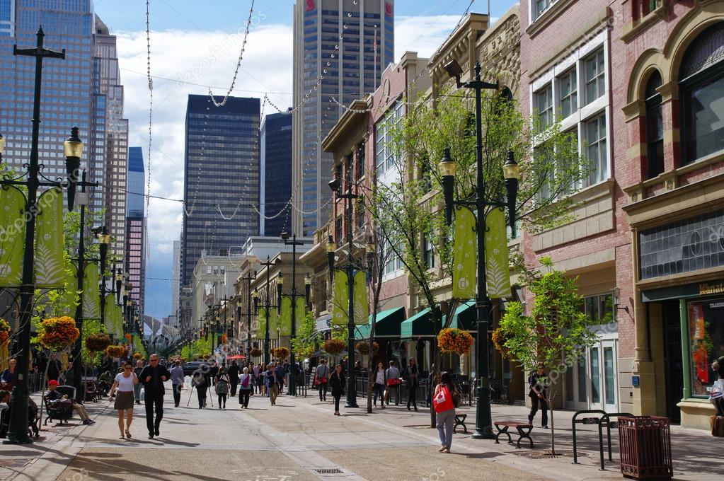 CALGARY, CANADA - MAY 26: Tourists stroll along historic Stephen Avenue ...