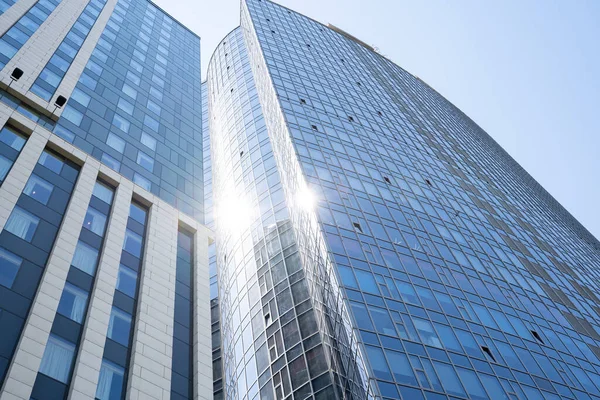 rays of the sun between two new high-rises. a ray of sun is reflected ...