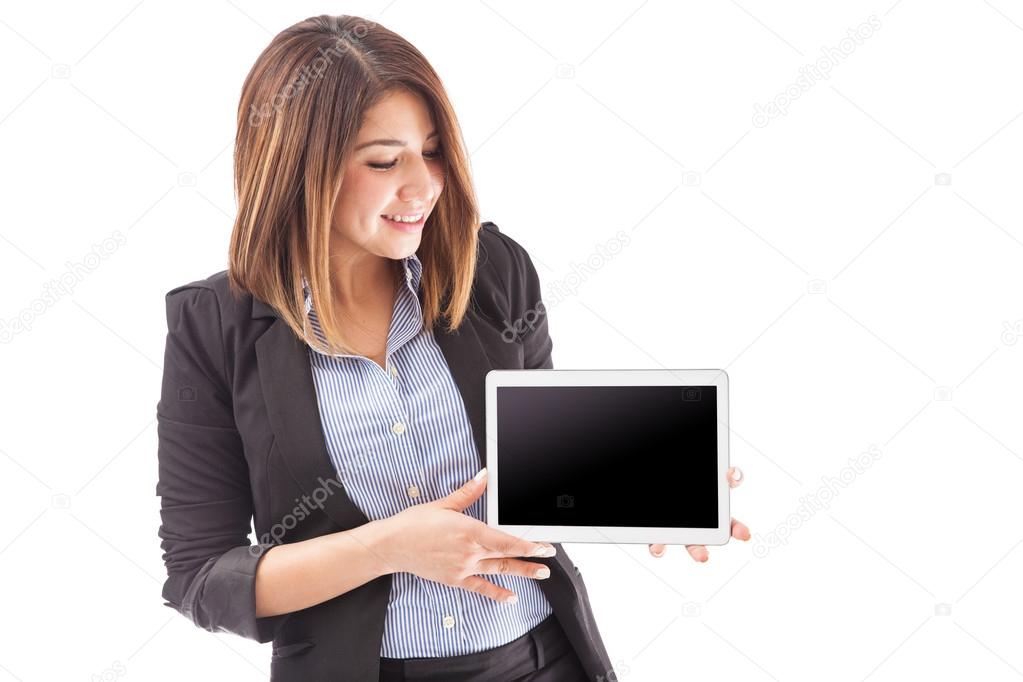 Bank representative showing a tablet Stock Photo by ©tonodiaz 105591090