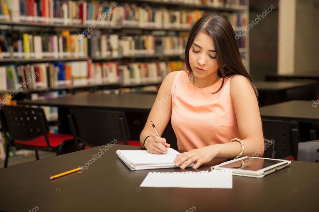 Student doing some work Stock Photo by ©tonodiaz 72580161