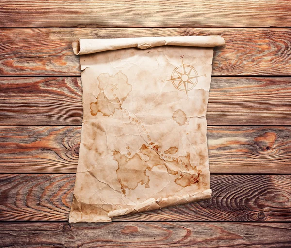 Old treasure map on wooden background Stock Photo by ©merrydolla 26143411
