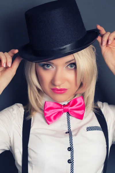 Woman wearing top hat and bow tie — Stock Photo © merrydolla #59162077