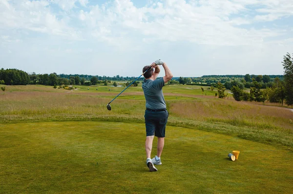Male golf player on professional golf course. Golfer with golf club ...