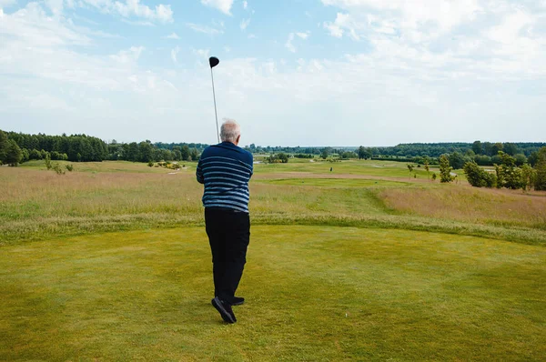 Male golf player on professional golf course. Golfer with golf club ...