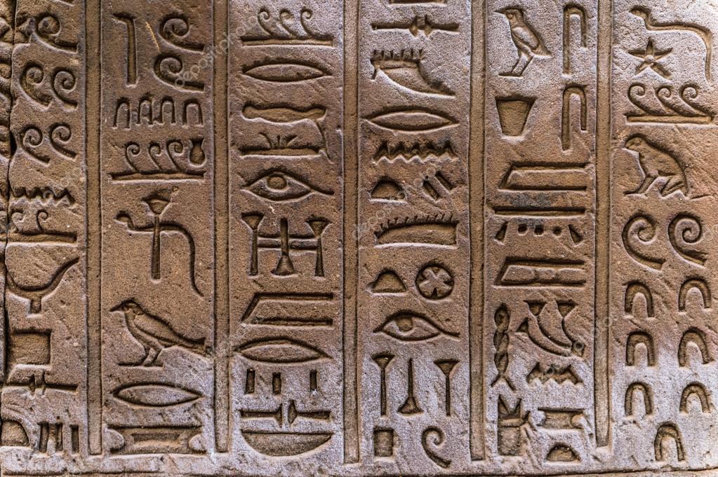 Egyptian hieroglyphs on the wall of the Horus temple in Egypt Stock ...