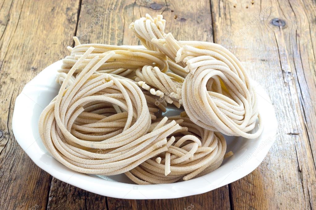 Pici, hand-rolled pasta — Stock Photo © fpwing_c #68734293