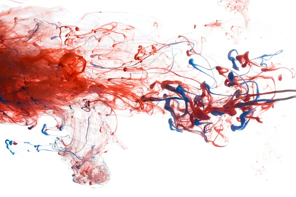 Red and green ink in water — Stock Photo © Shtanzman #127668092