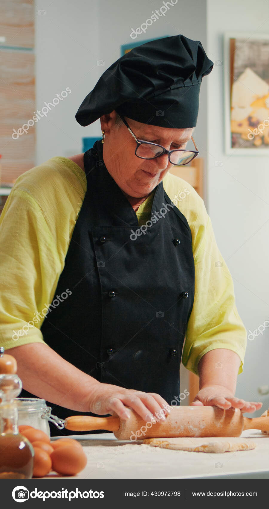 Woman chef using wooden rolling pin — Stock Photo © DragosCondreaW ...