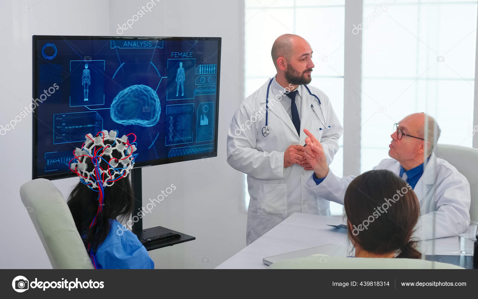Doctor talking about brain activity during conference with medical ...