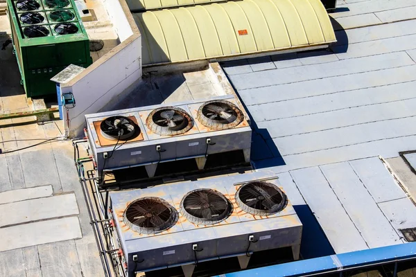 Old ventilation system on the roof of an industrial building - Stock ...