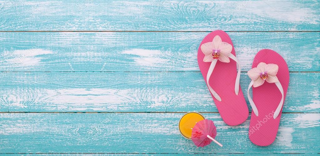 Pink sandals on wooden background Stock Photo by ©victoreus 102484290