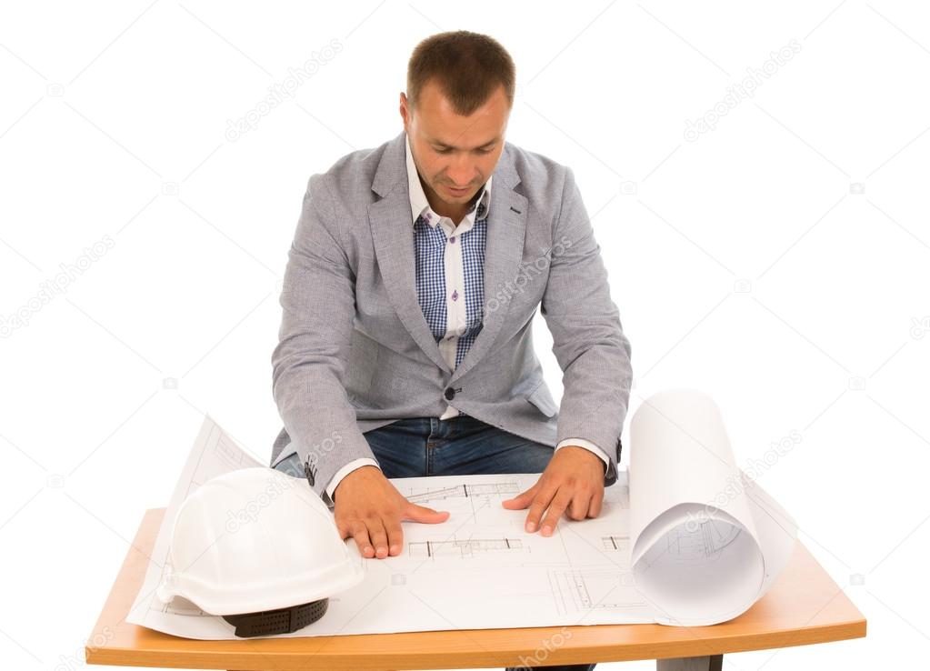 Architect checking a building plan Stock Photo by ©Vaicheslav 53765555