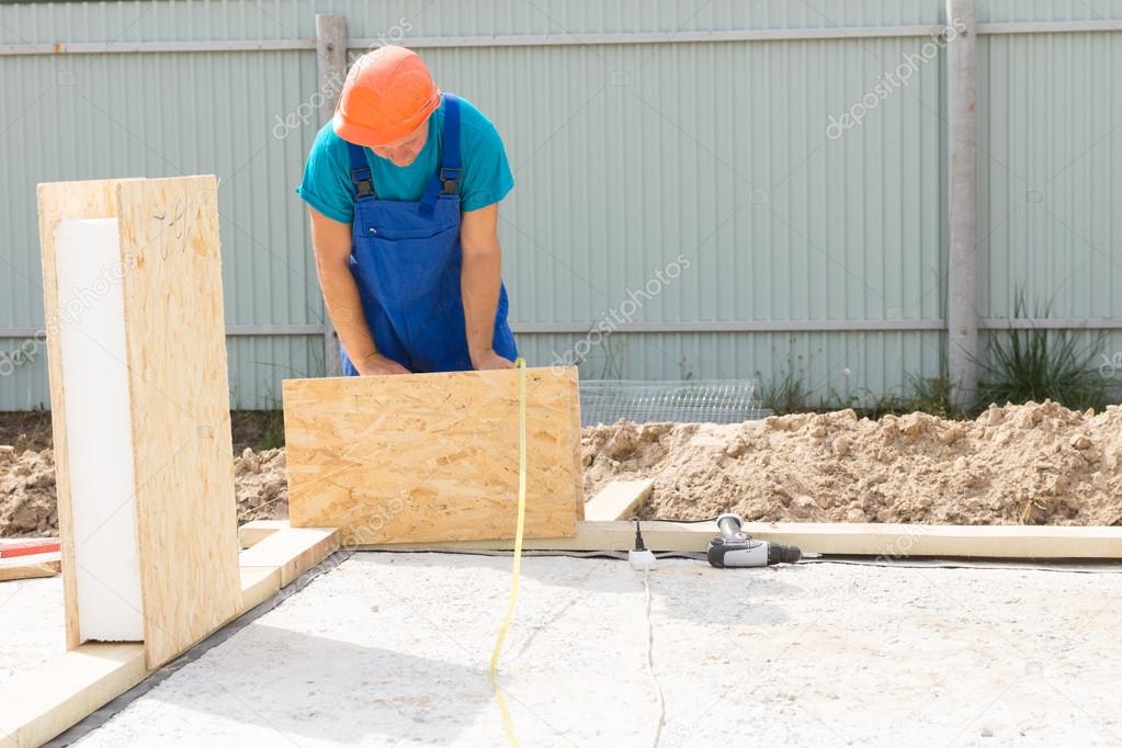 Busy Construction Worker Building House — Stock Photo © Vaicheslav ...