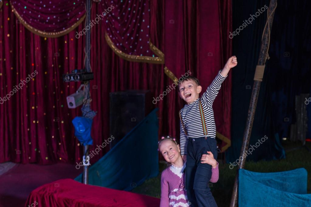Girl Lifting Boy Up on Shoulders on Stage — Stock Photo © Vaicheslav ...