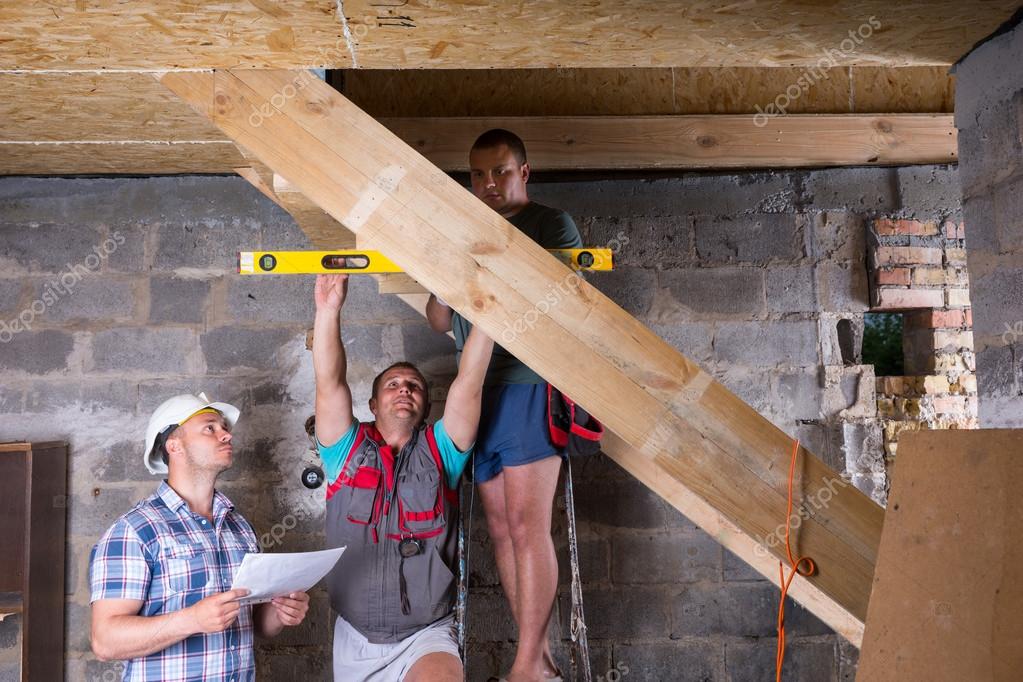 Team of Construction Workers Building Staircase Stock Photo by ...
