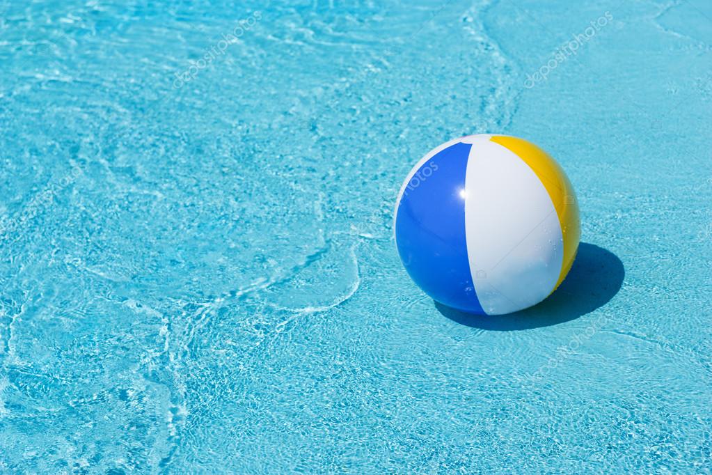 Inflatable Beach Ball Floating at Edge of Pool Stock Photo by ...