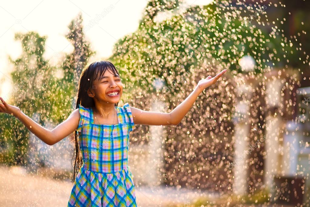 Little Girl Dancing In The Rain