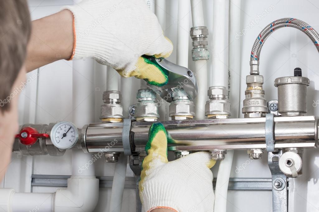 Worker fixing heating system, close up photo — Stock Photo ...