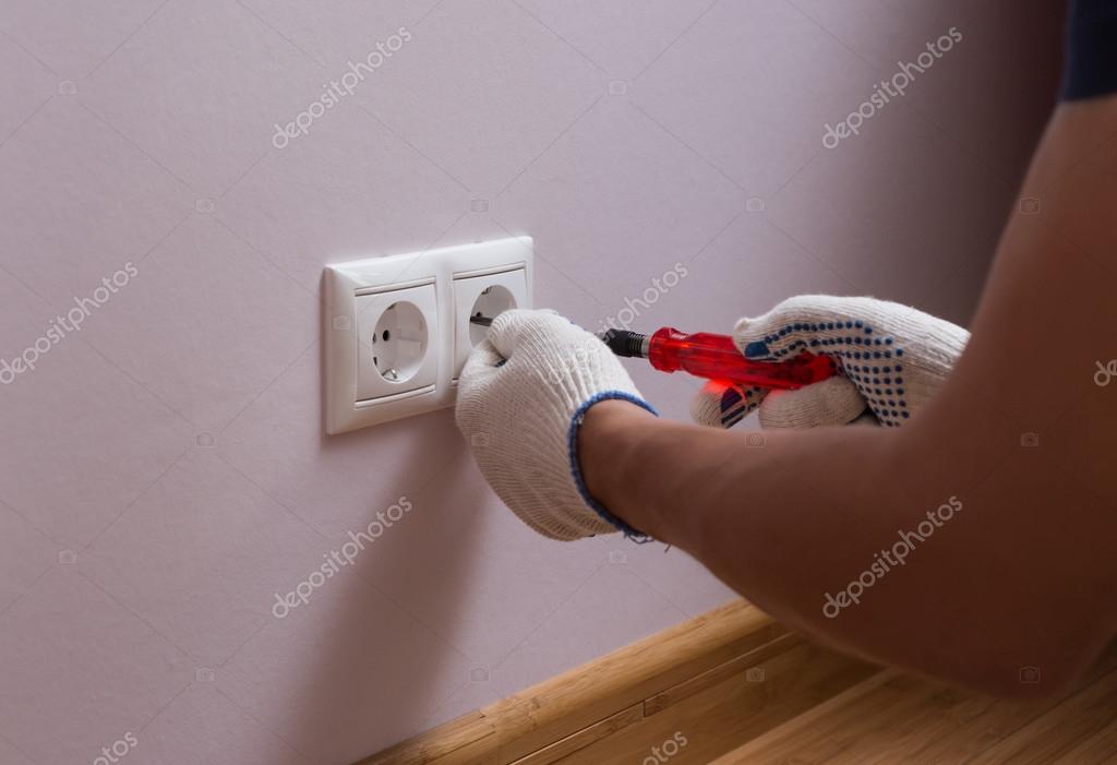 Electrician installing a wall power socket, close up photo — Stock ...