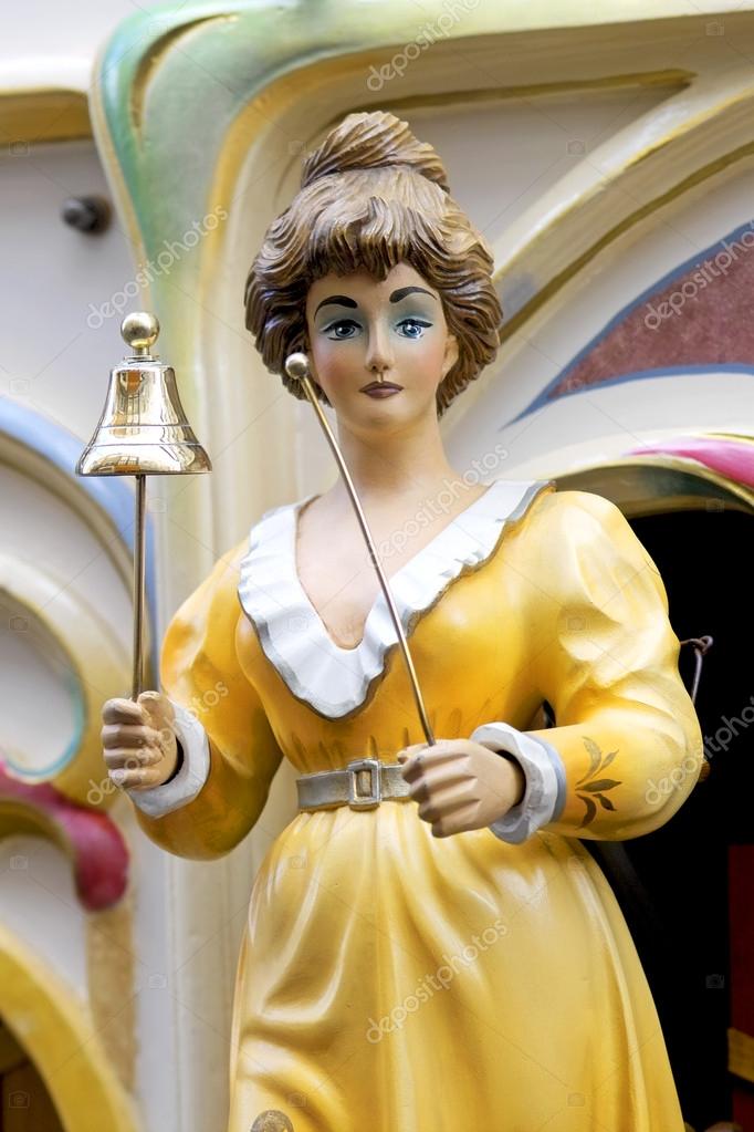 Female figure ringing a bell on a barrel organ — Stock Photo ...