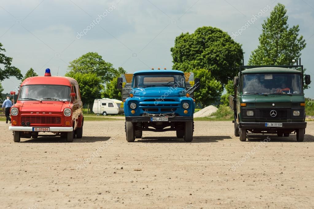 Commercial trucks Ford Transit (left), a popular soviet truck ZIL-130 ...