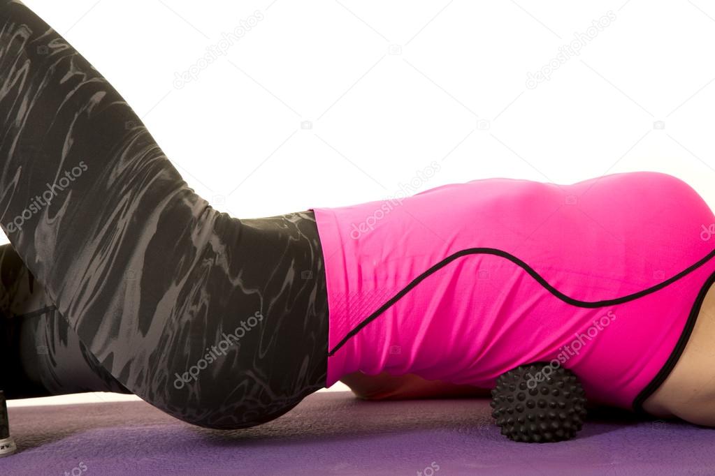 Woman fit body rolling on a ball — Stock Photo © alanpoulson #110656696