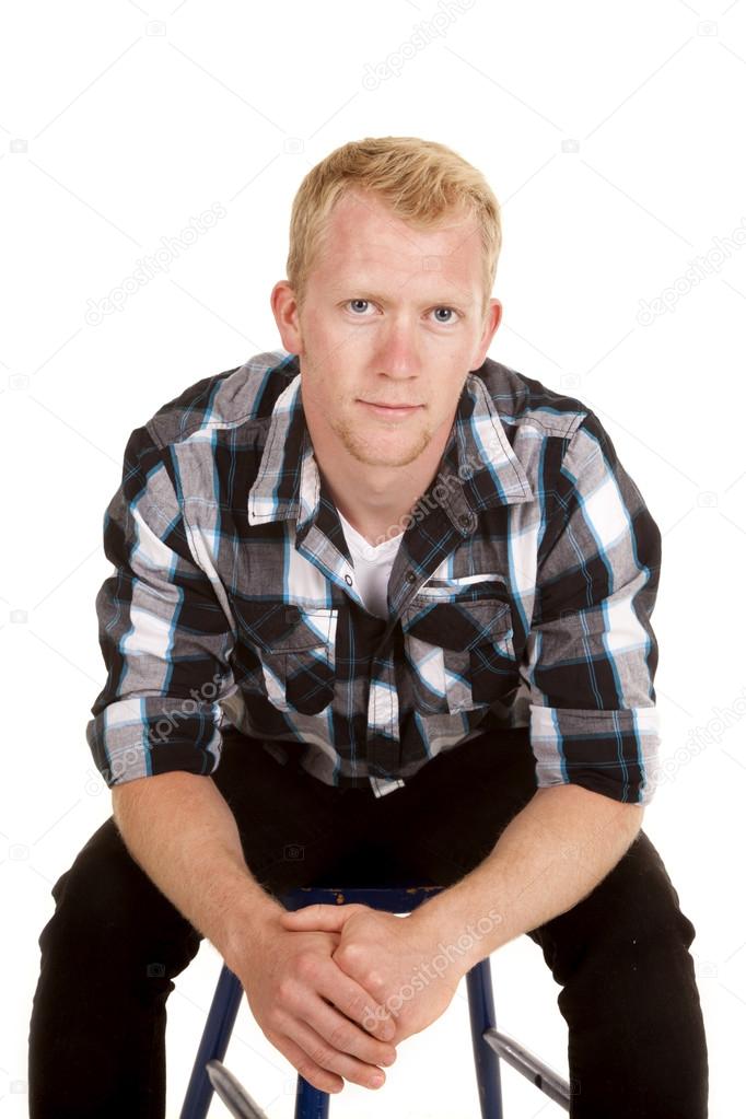 Man in plaid shirt sit lean forward serious Stock Photo by ©alanpoulson ...