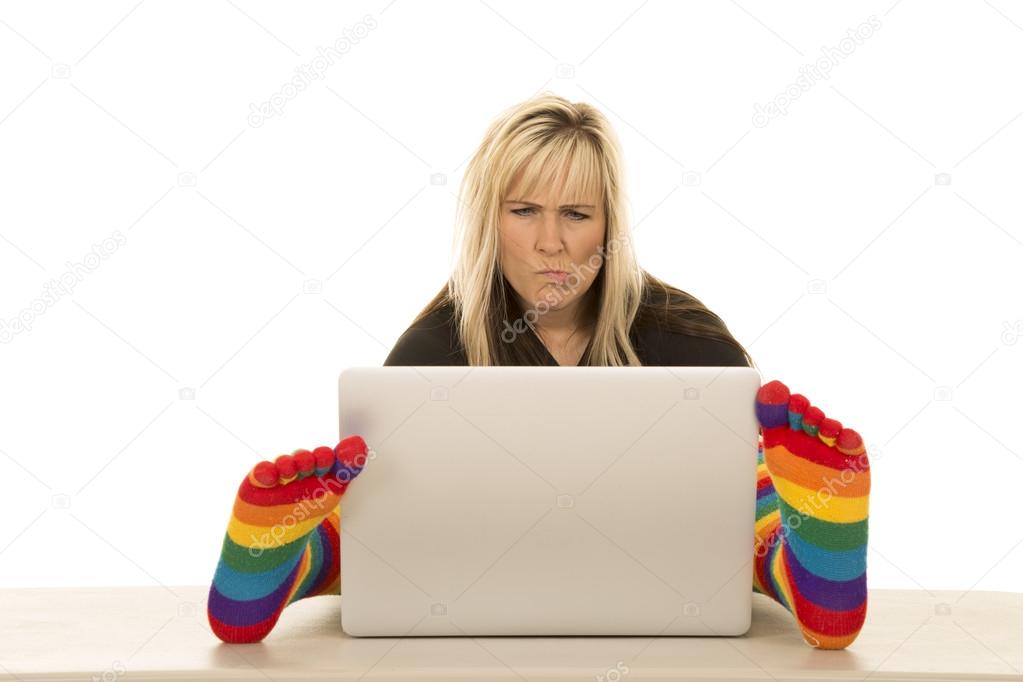 Woman in colored socks with computer Stock Photo by ©alanpoulson 61725171