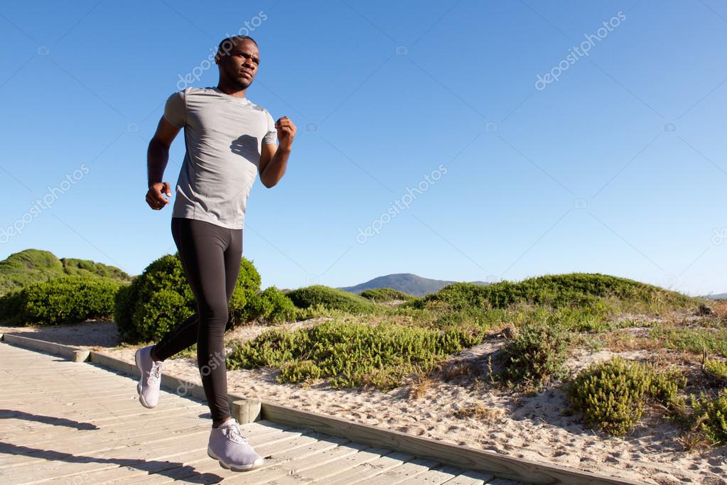 Fitness male model running at the beach ⬇ Stock Photo, Image by ...