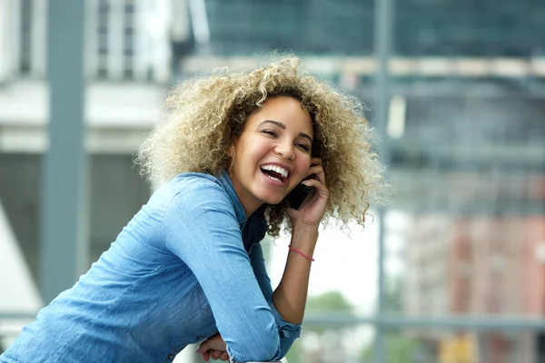 Woman laughing on telephone call - Stock Image - Everypixel