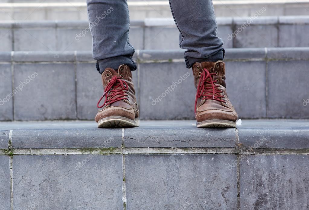 Male leather boots on steps — Stock Photo © mimagephotos #52517637