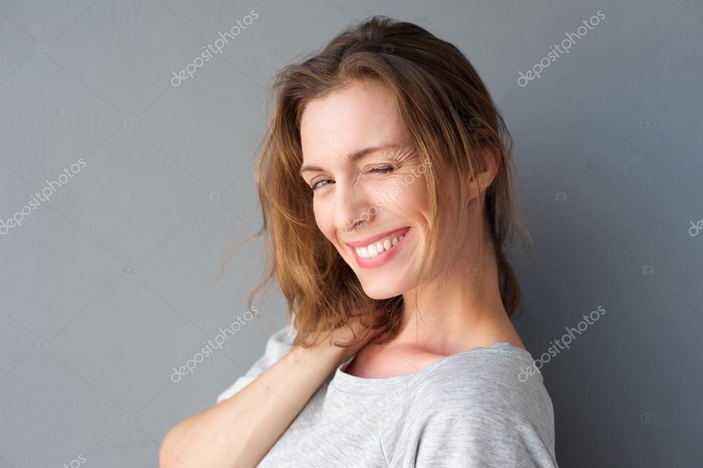 Beautiful woman winking her eye and flirting Stock Photo by ...