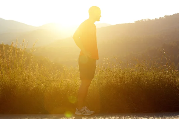 Silhouette male jogger standing outside - Stock Image - Everypixel