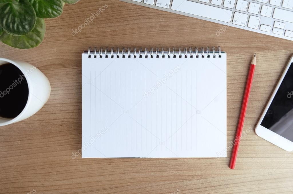 Office desk table with computer, smartphone, supplies, flower and ...