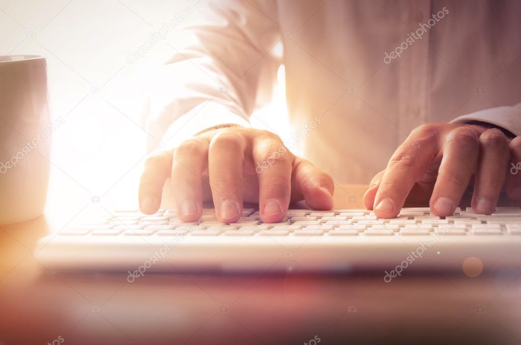 Closeup of man's hands typing on keyboard Stock Photo by ©Variant 83491964