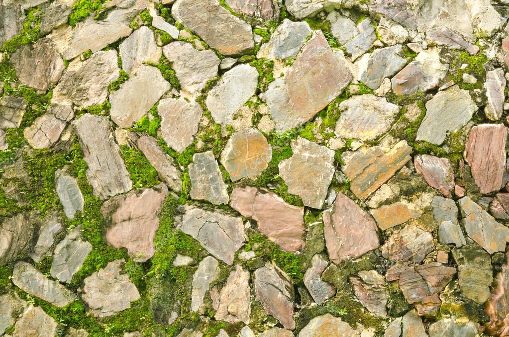 Old stone wall covered with moss Stock Photo by ©bentaboe 89136486