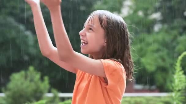 Girl playing in rain — Stock Video © VaLiza #121241712