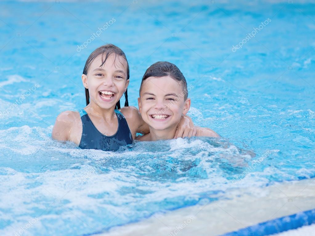 Children in pool — Stock Photo © VaLiza #123997184