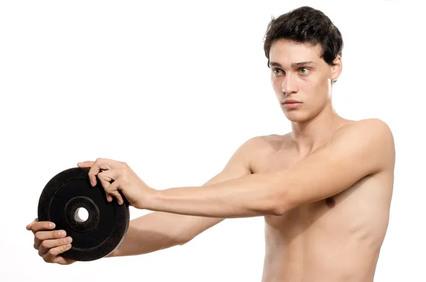 Um homem magro a tirar uma selfie com o telemóvel enquanto treina o ...