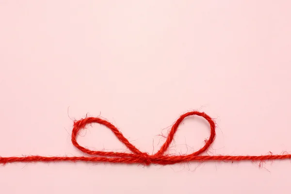 String tied in a bow on white Stock Photo by ©bennyartist 36511653