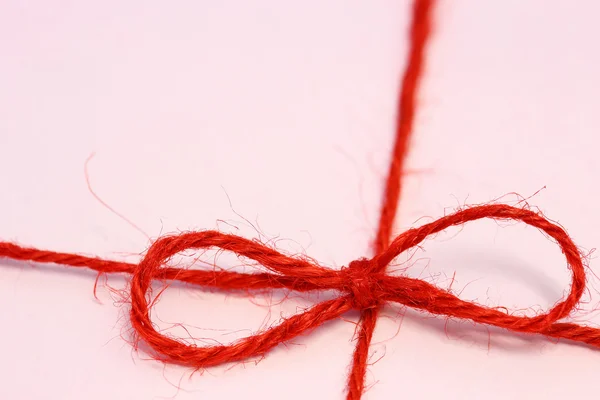 String tied in a bow on white Stock Photo by ©bennyartist 36511653