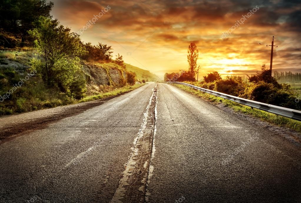 Asphalt road receding into a distance Stock Photo by ©alexlukin 68881011