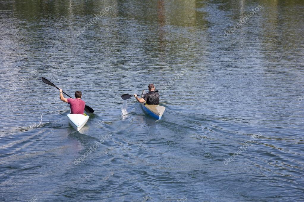 Two men in a canoes — Stock Photo © smuki #53847553
