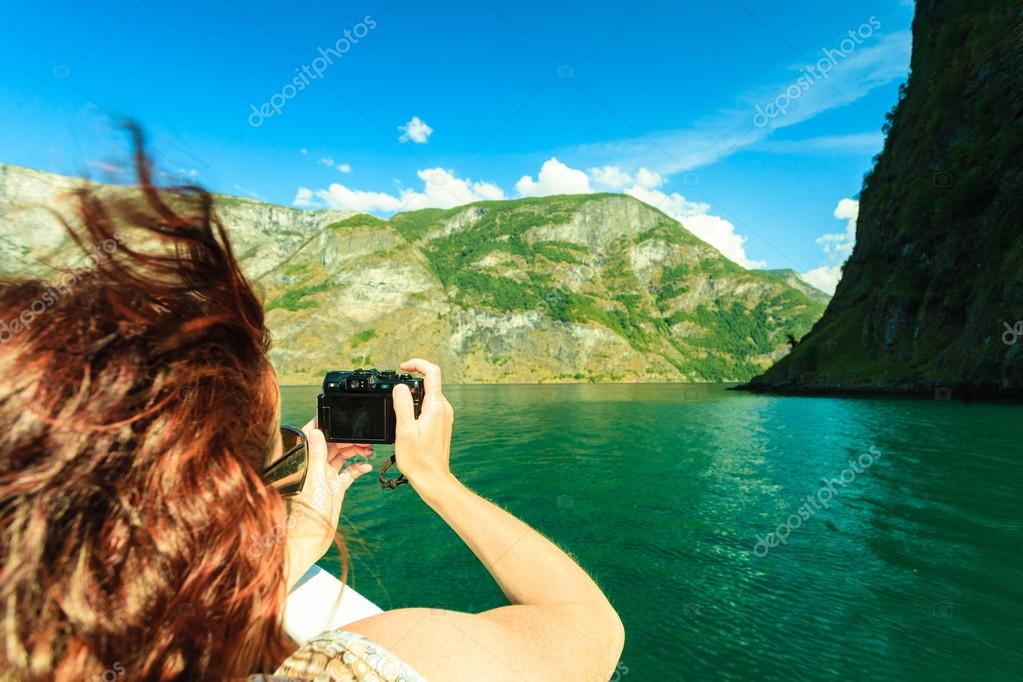 Tourism. Woman with camera on ship, fjord in Norway. — Stock Photo ...