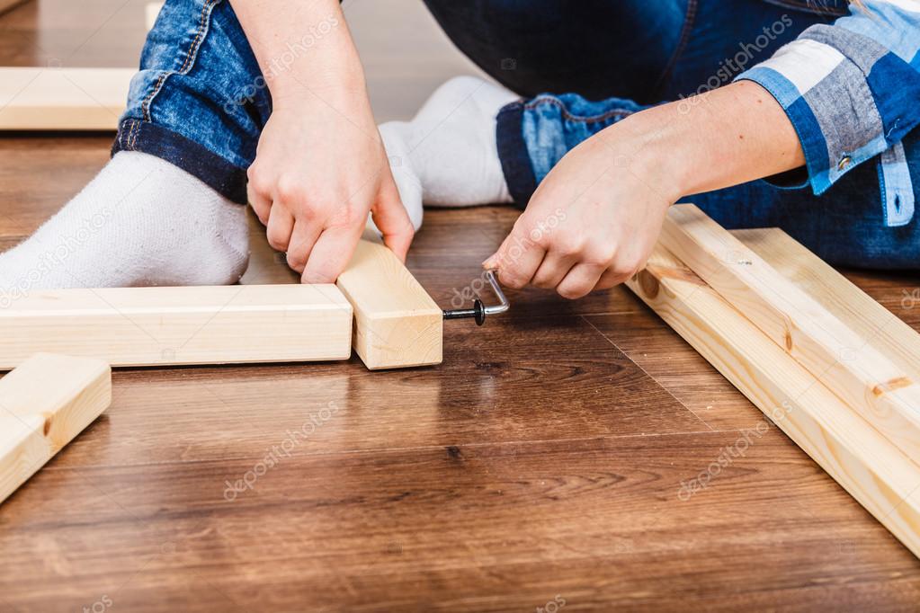 Assembling wood furniture using hex key. DIY. — Stock Photo © Voyagerix ...