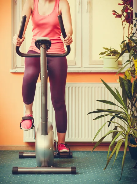Human working out on exercise bike. Fitness. - Stock Image - Everypixel