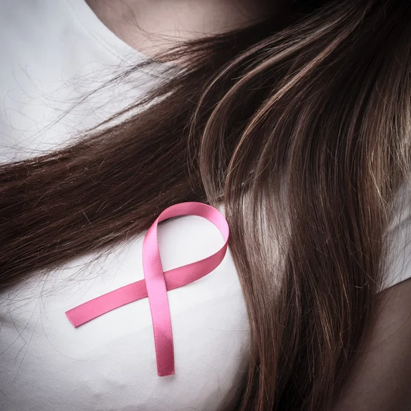 Woman chest with pink cancer ribbon - Stock Image - Everypixel