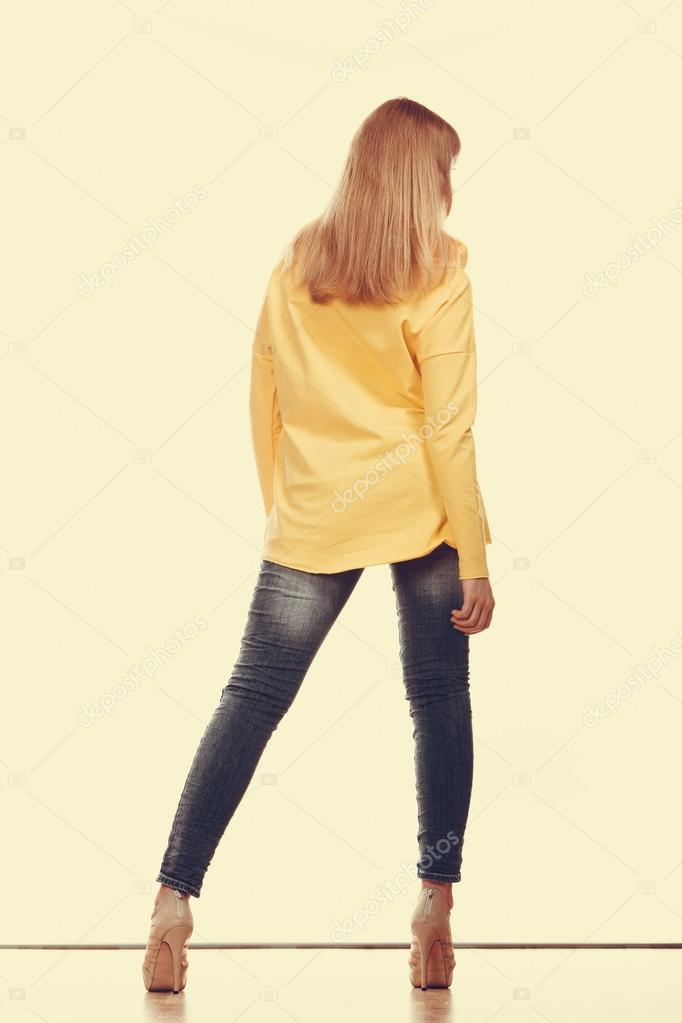 Woman posing, back view Stock Photo by ©Voyagerix 66236081