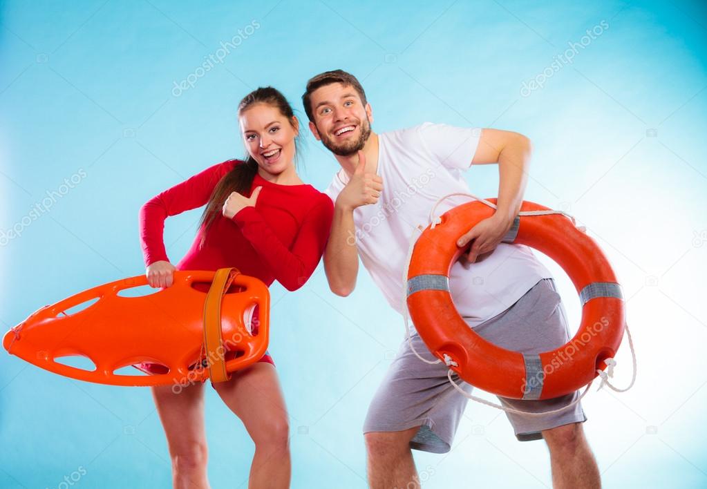 Lifeguards on duty with equipment — Stock Photo © Voyagerix #72975545